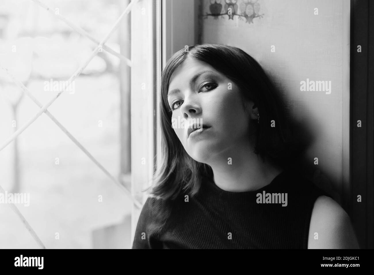 Light through window adult home Black and White Stock Photos & Images ...