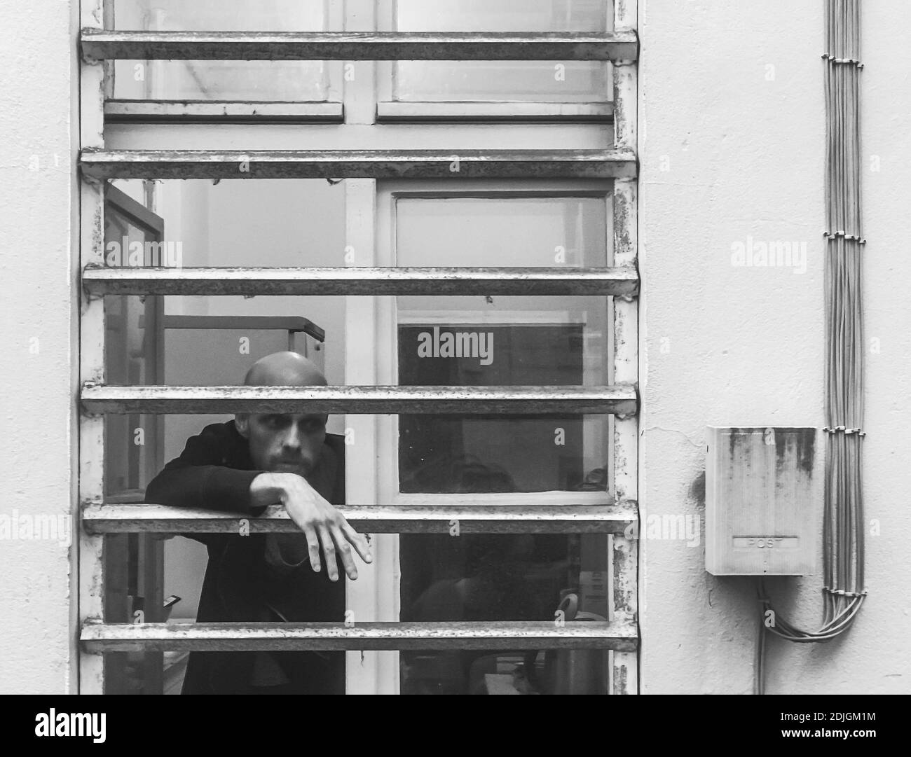 Person looking through window exterior Black and White Stock Photos ...