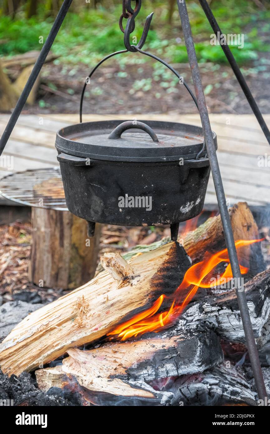 Cooking food in a cauldron over campfire in England Stock Photo - Alamy
