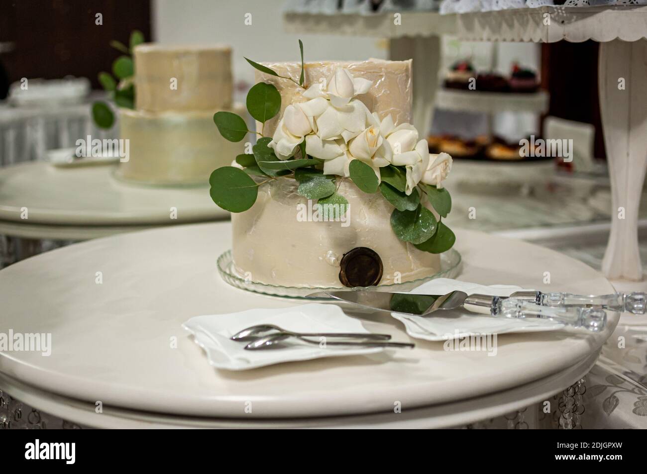 The wedding cake. Wedding buffet. Cake decorated with roses Stock Photo ...