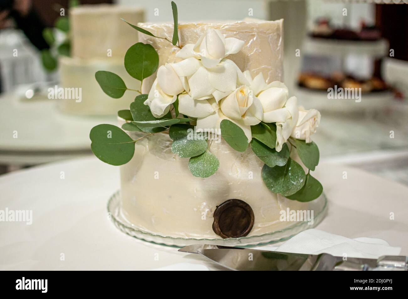 The wedding cake. Wedding buffet. Cake decorated with roses Stock Photo ...