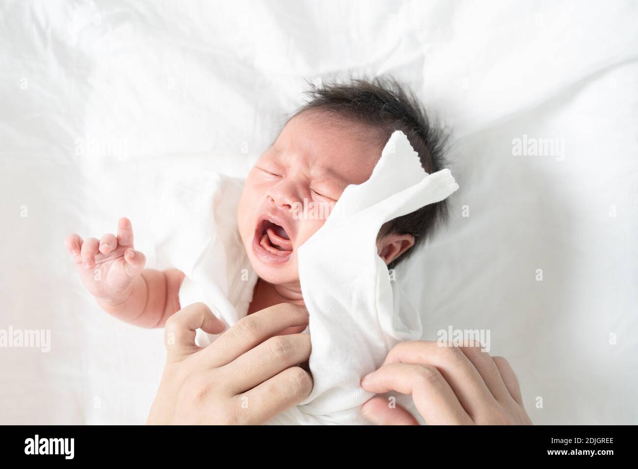 Hand above new born hi-res stock photography and images - Alamy