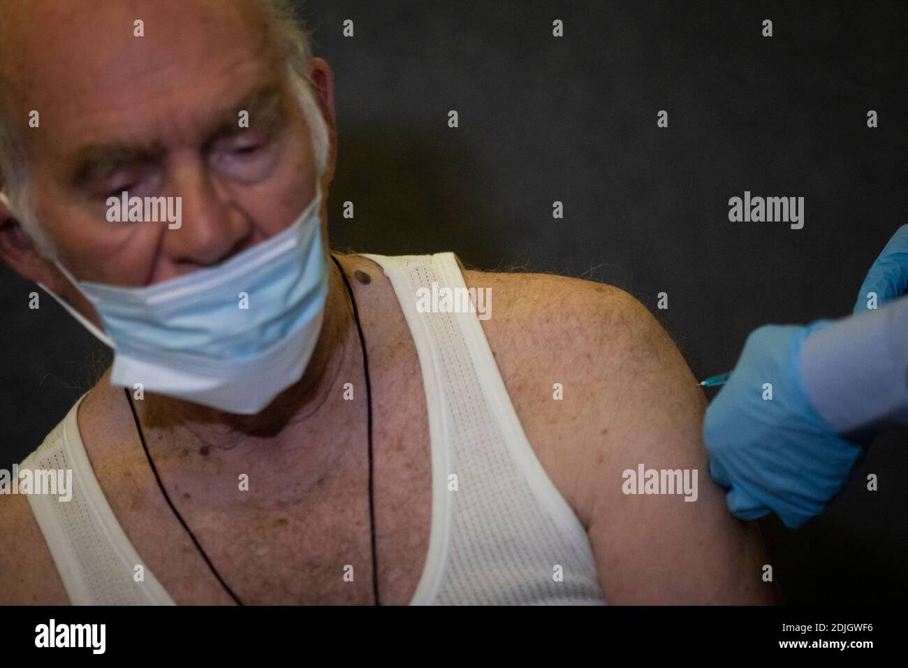 Sir David Ratford receives the first of two injections with a dose of ...