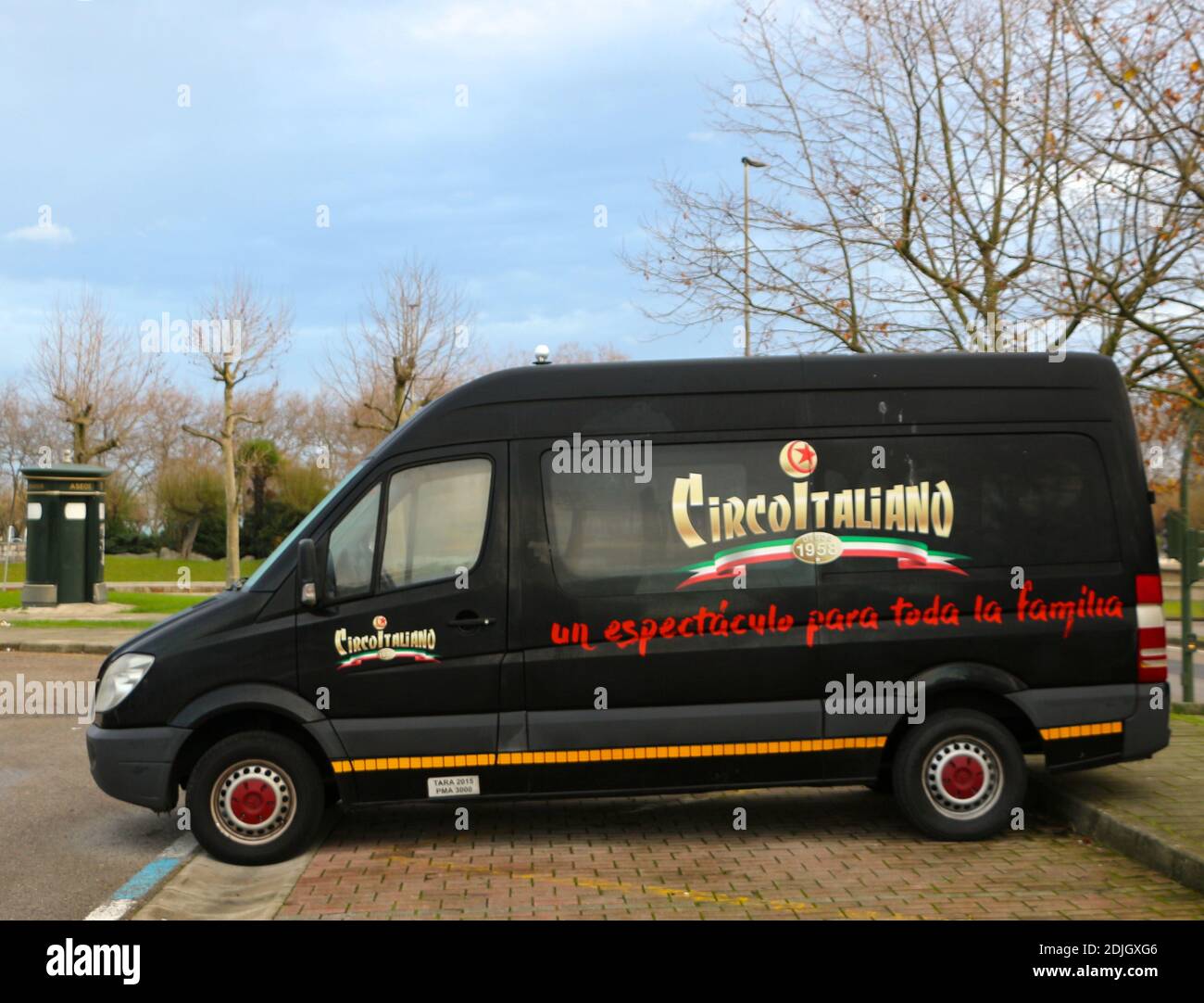 Black van from The Italian Circus camped in the car park of Racing ...