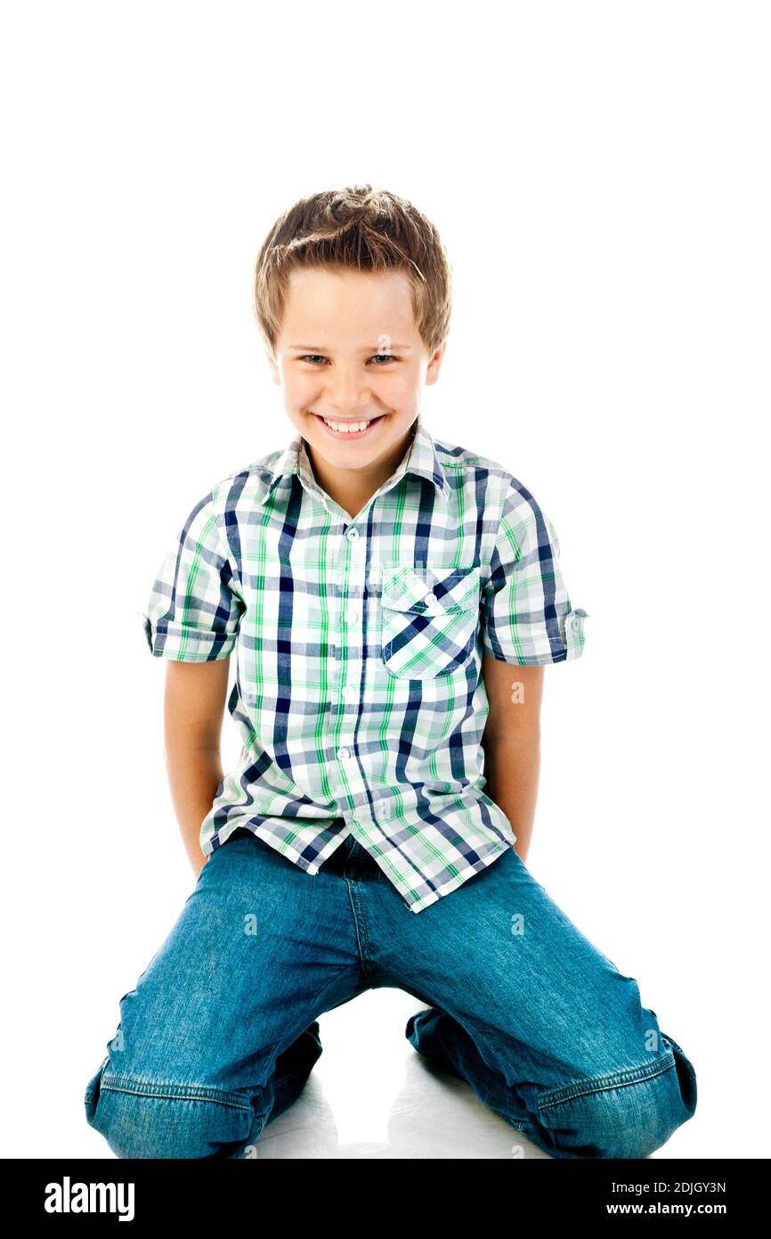 sitting boy isolated on a white background Stock Photo - Alamy