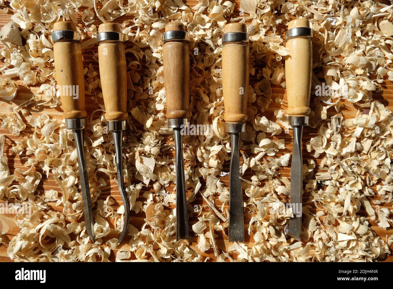 hobby toll chisels on the carpenter's workbench, chisel in the yellow ...