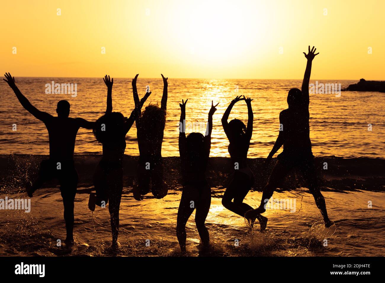 Happy friends sunset jump friendship hi-res stock photography and ...