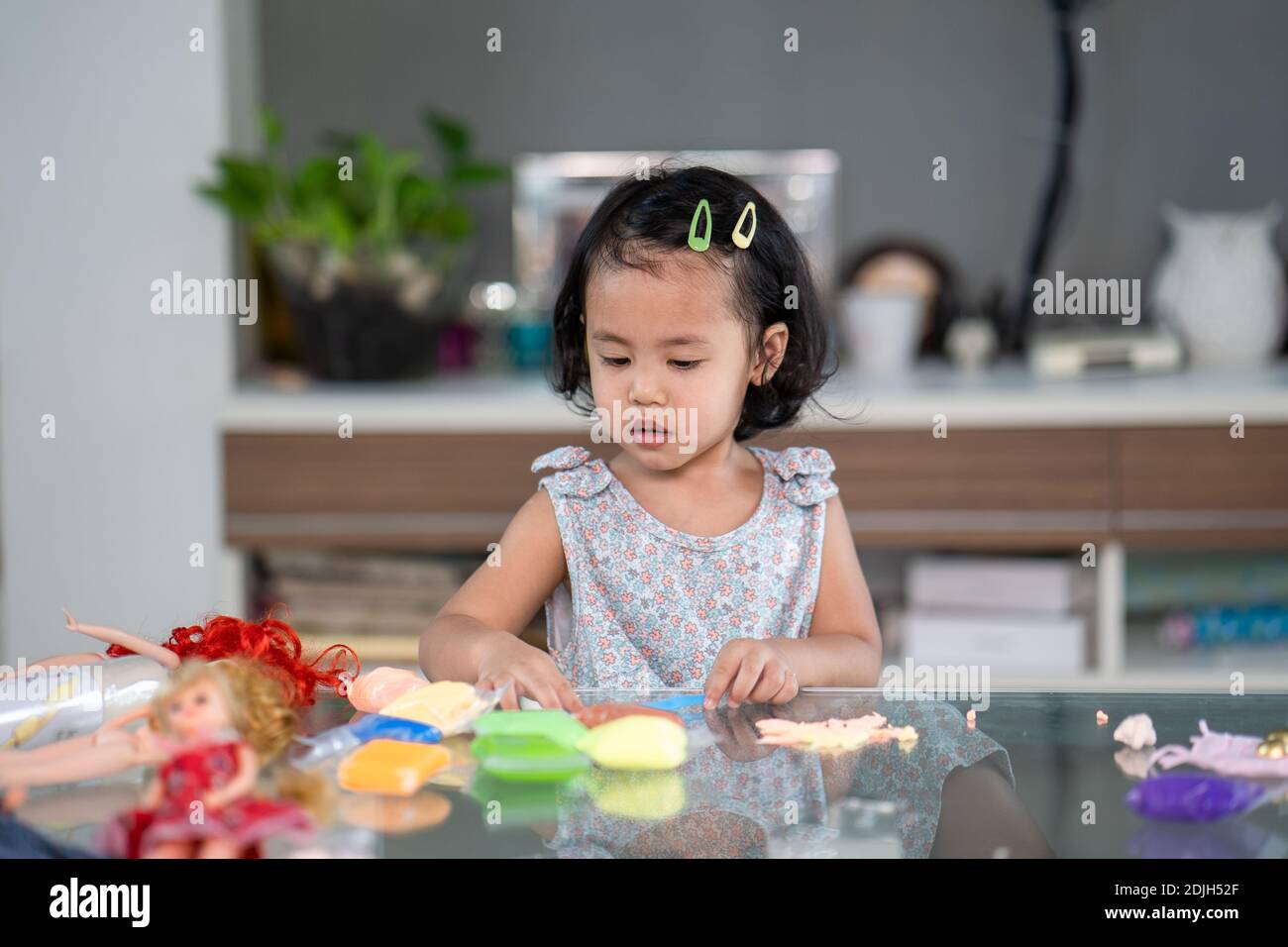 Cute Little Girl Enjoy Playing Play Doh At Home Stock Photo - Alamy