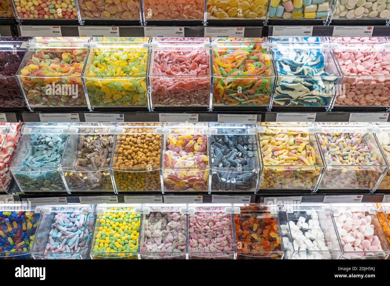 Close up view of stand of colorful candies. Unhealthy food concept ...