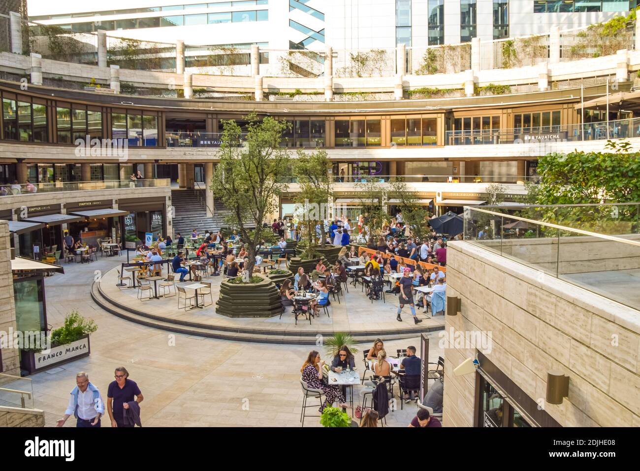 People at bars and restaurants in Broadgate Circle, City of London Stock Photo - Alamy