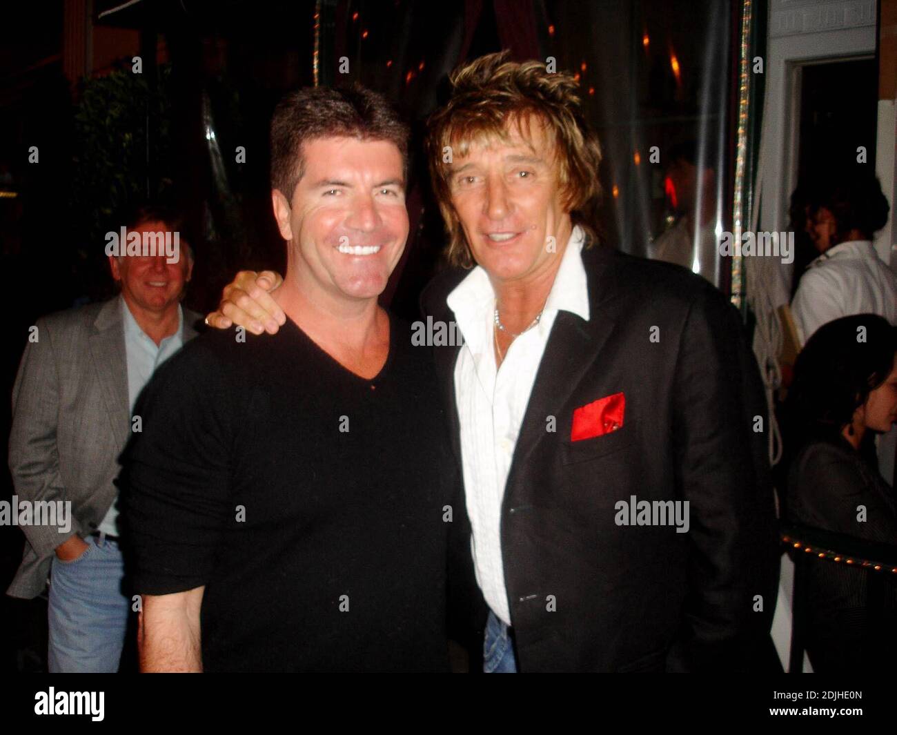 Rod Stewart poses with Simon Cowell at Il Sole, Los Angeles 4/18/06 ...