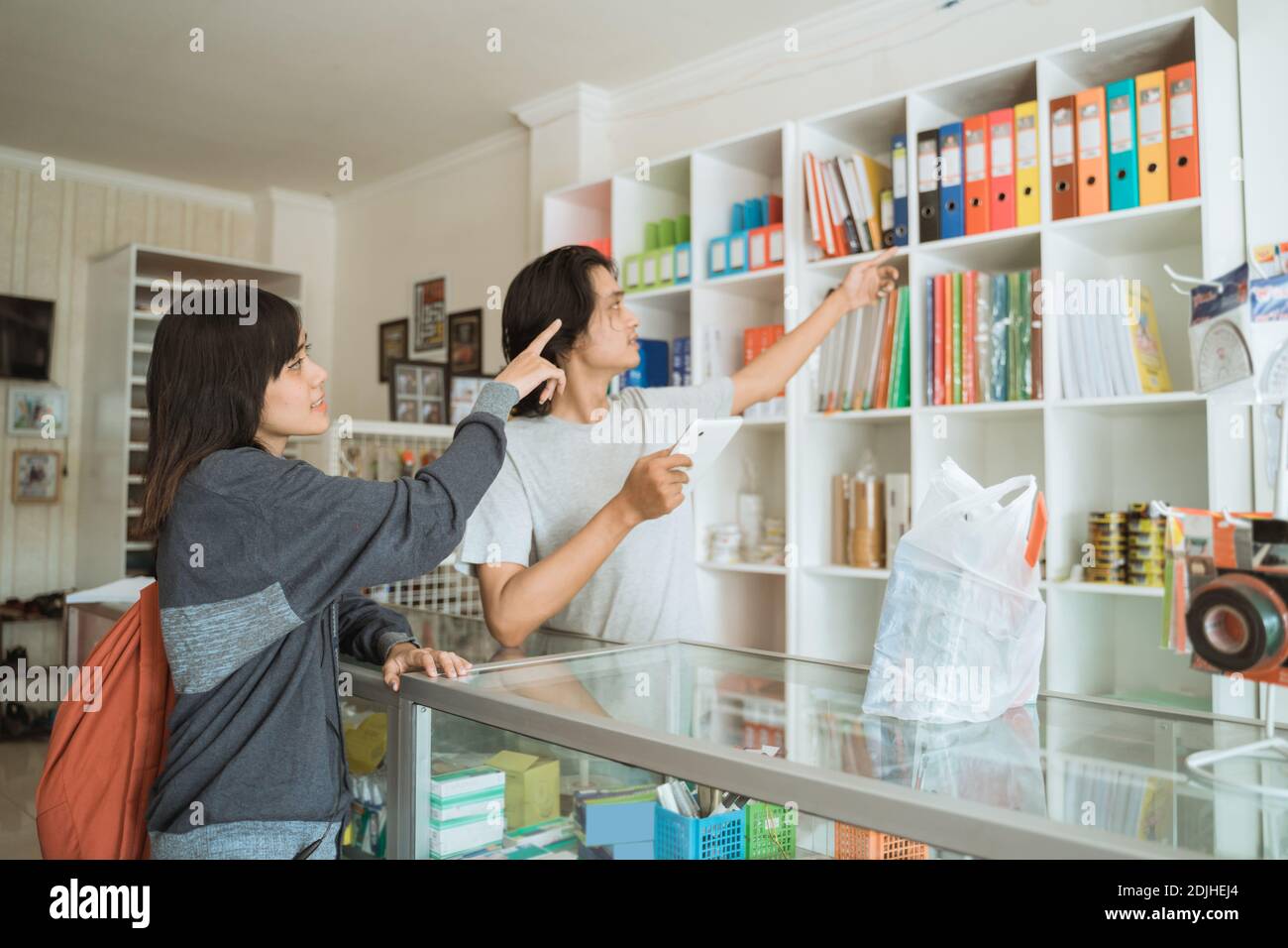 Young girl visiting a stationery shop choosing item Stock Photo - Alamy Young girl visiting a stationery shop choosing item Stock Photo - Alamy