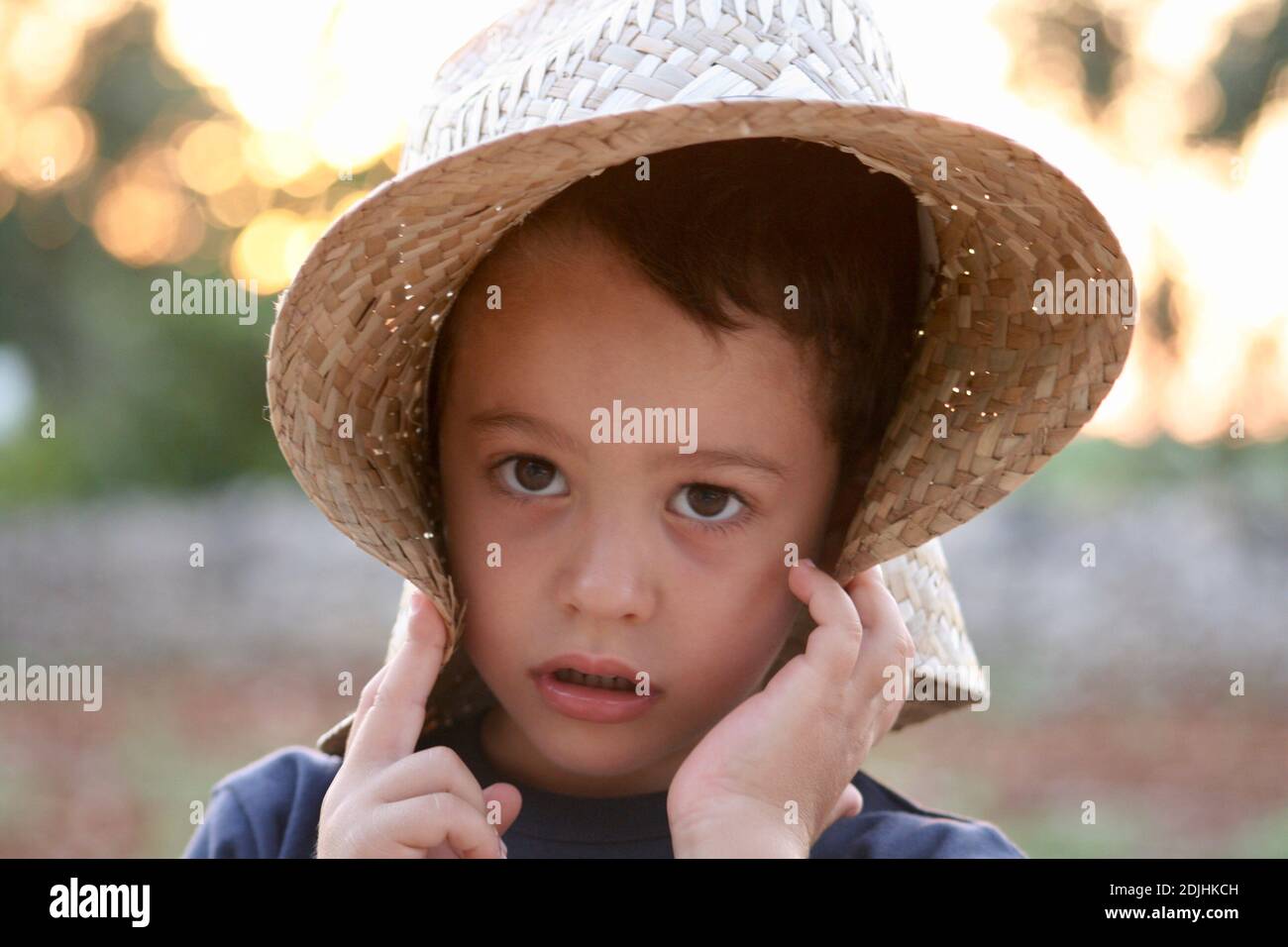 Boys wearing straw hat hi-res stock photography and images - Alamy
