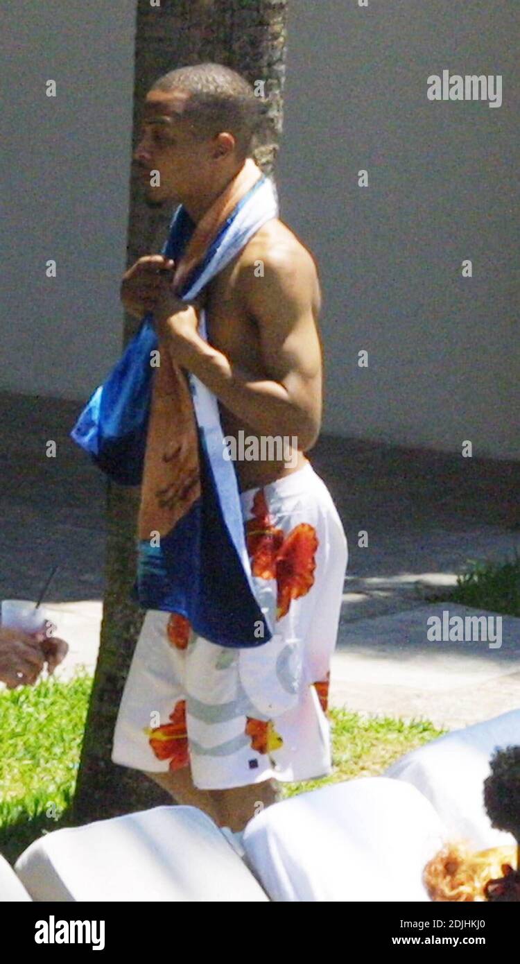 Exclusive Rapper T.I. enjoys some female company at an exclusive Miami ...