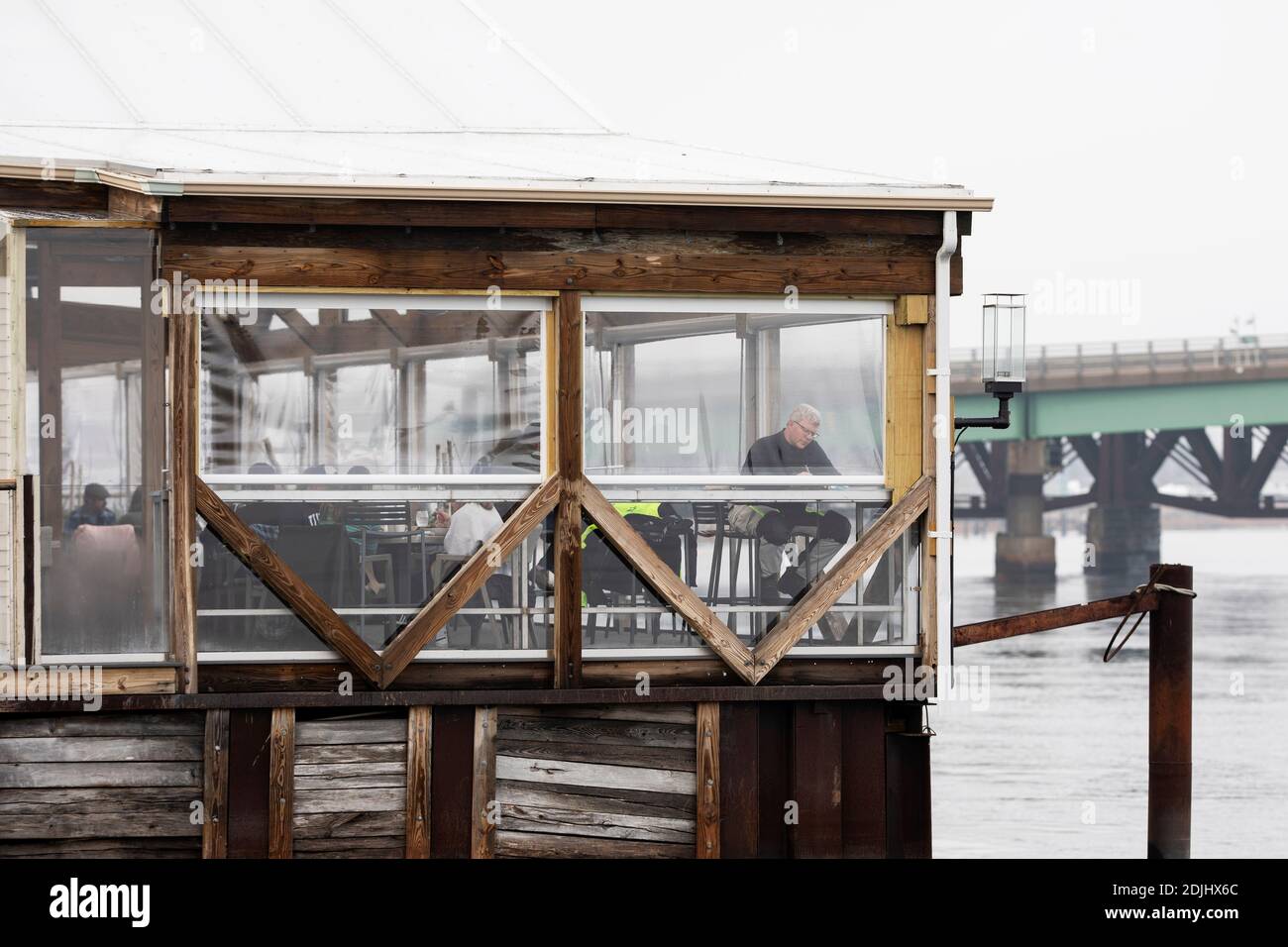 Customers seated on the Tuscan Sea Grill and Bar patio on a winter day ...