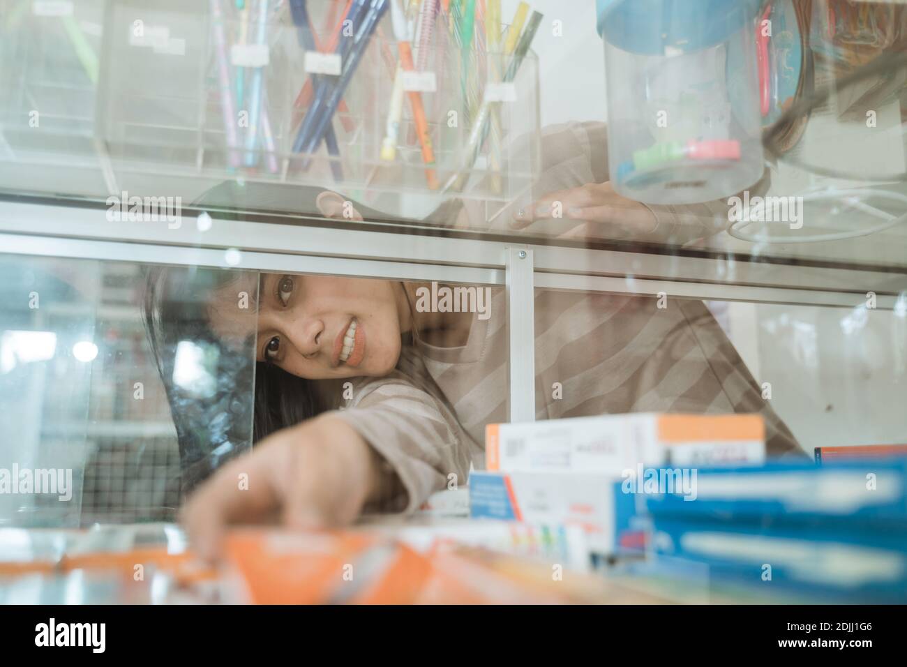 Young girl is taking stationery customer orders Stock Photo - Alamy