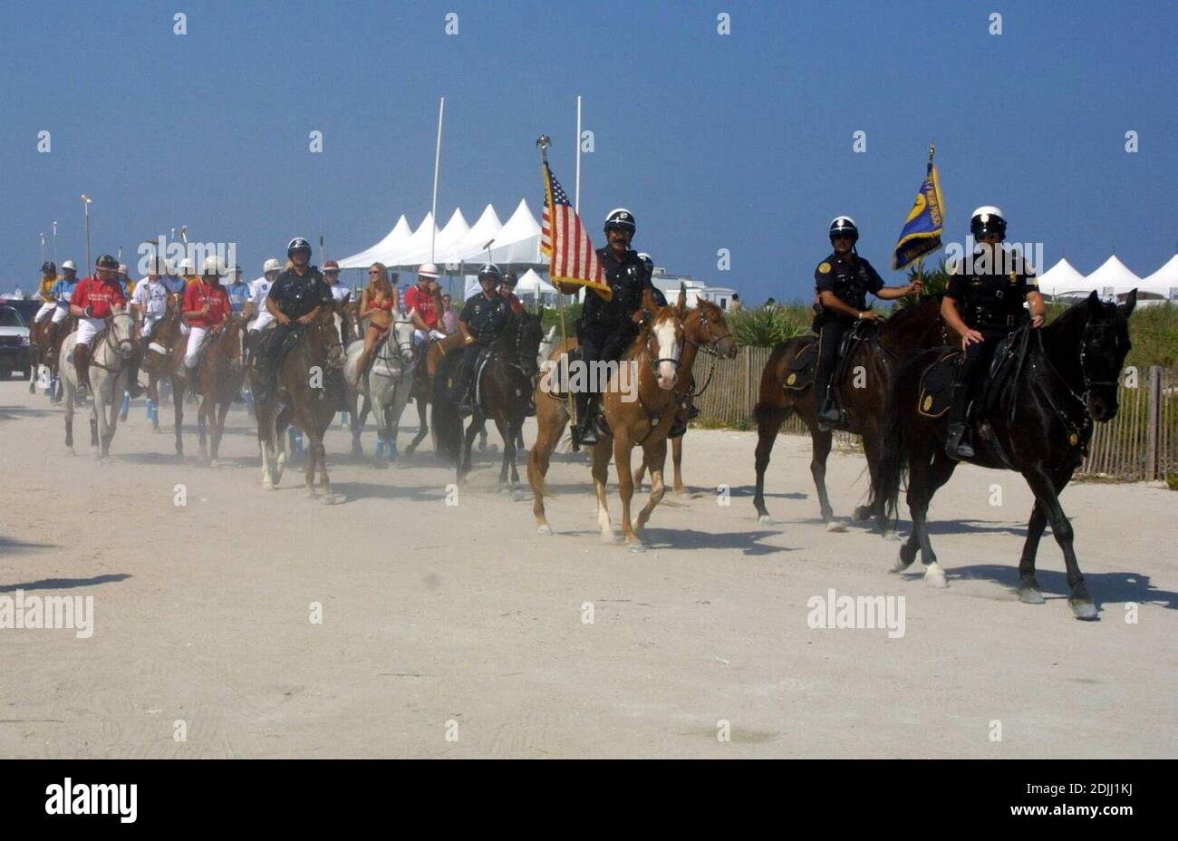 Bikini Clad Girls mount horses to ride in the parade for the launch of ...