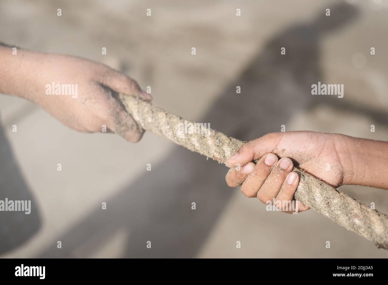 Two hands pulling rope hi-res stock photography and images - Alamy