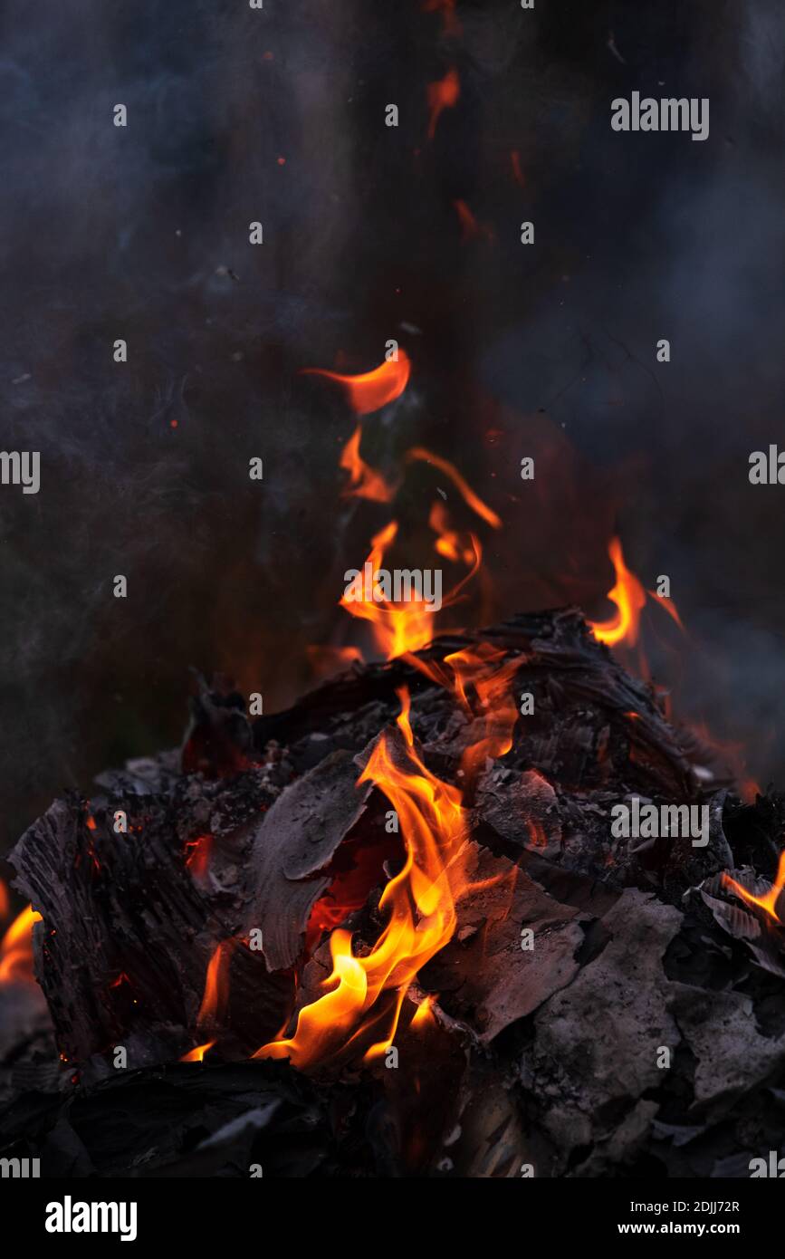 Burning pile of cardboard and waste paper Stock Photo - Alamy
