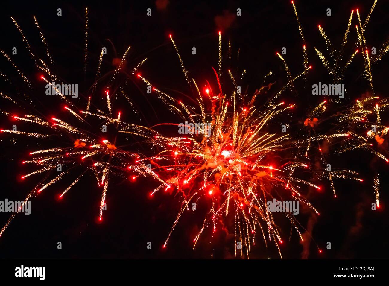 Colorful red fireworks in dark sky at night - holiday concept Stock ...