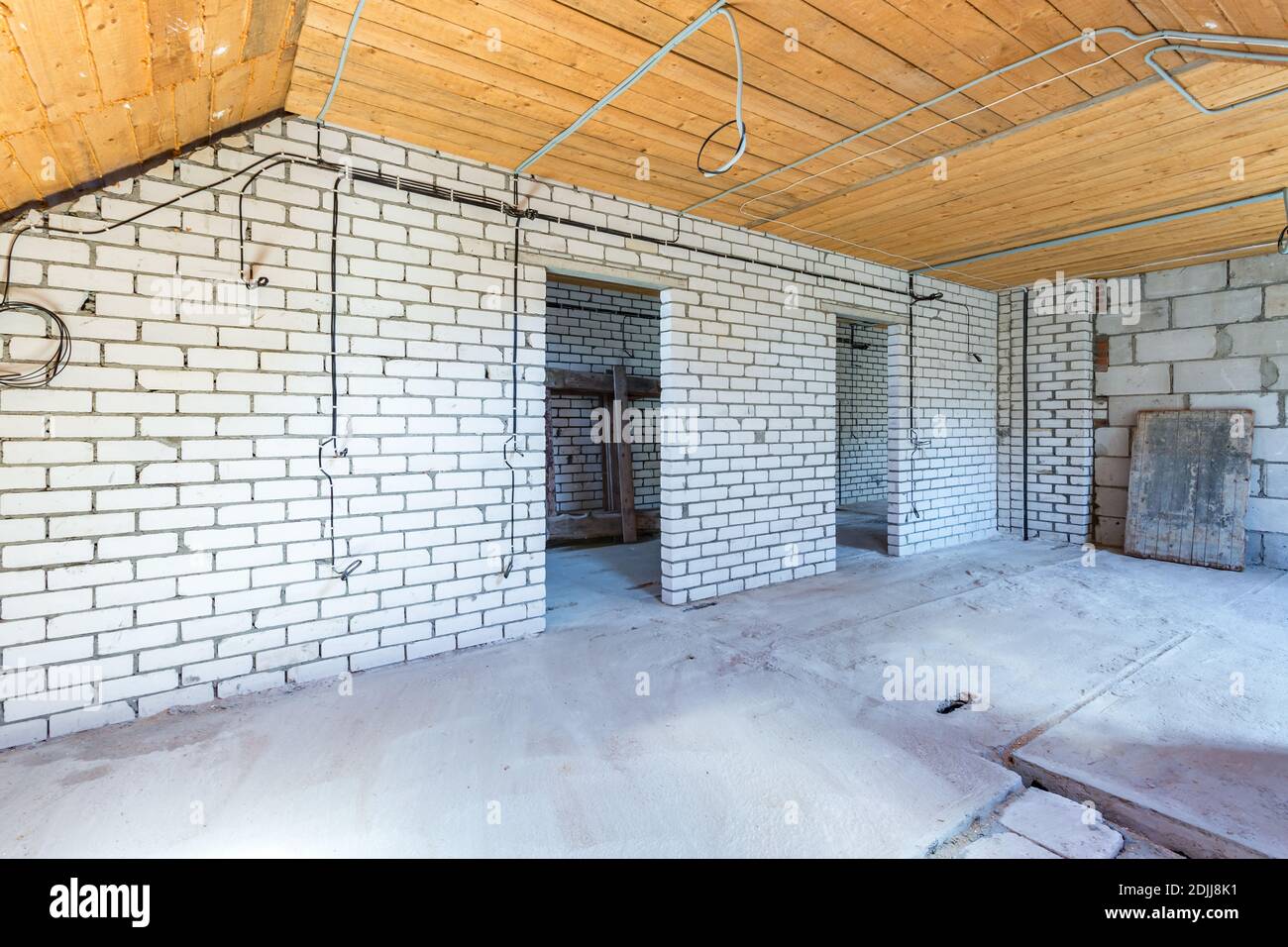 empty interior in house without repair on wooden mansard floor and ...