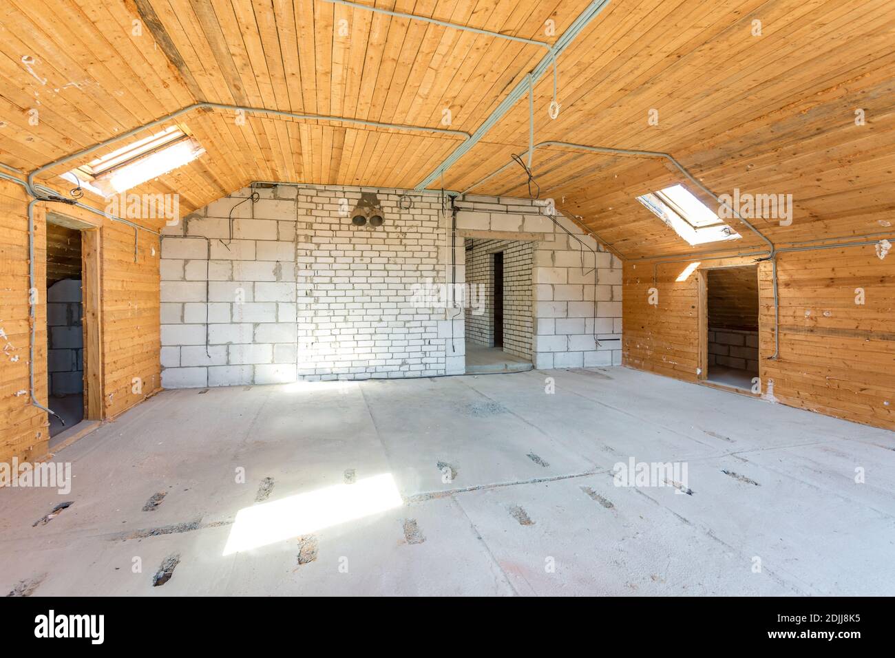 empty interior in house without repair on wooden mansard floor and ...