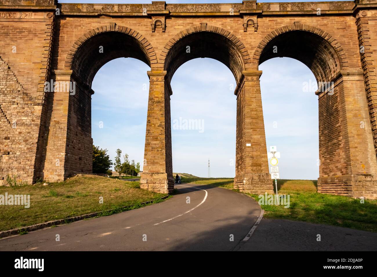 Bicycle path through a remnant of the Northern stone arch bridge of the ...