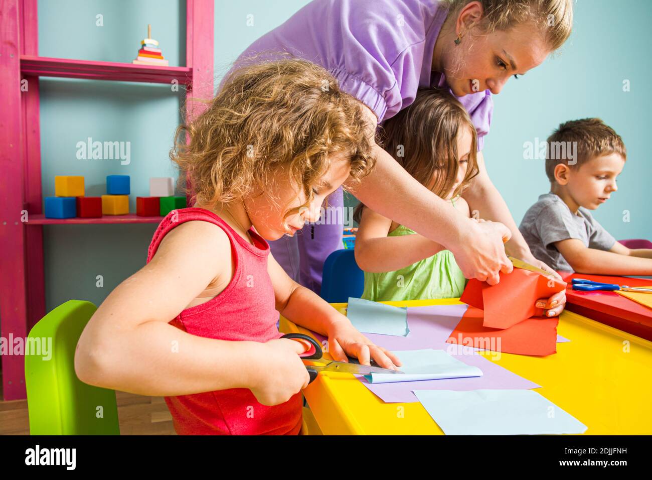 Girl and boy kid and origami hi-res stock photography and images - Alamy