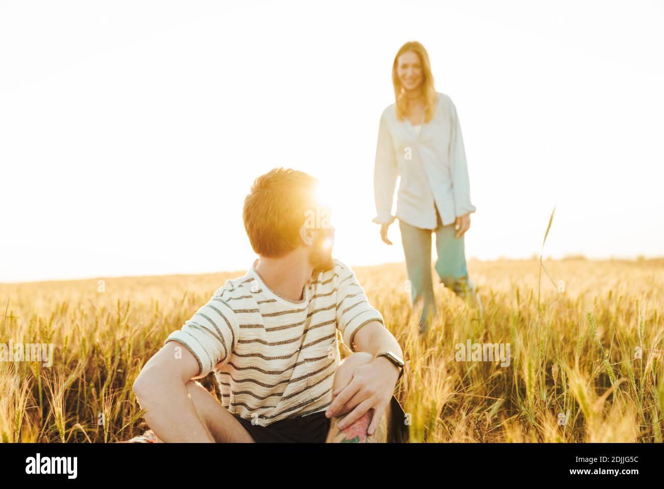 Smiling handsome man waiting girlfriend hi-res stock photography and ...