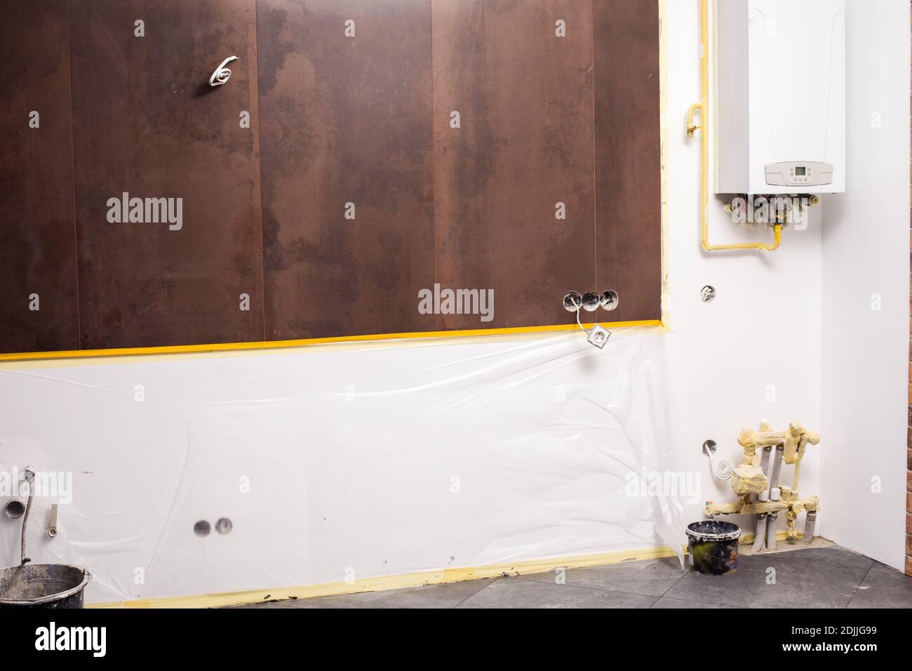 Repair of a utility room with a gas boiler Stock Photo - Alamy