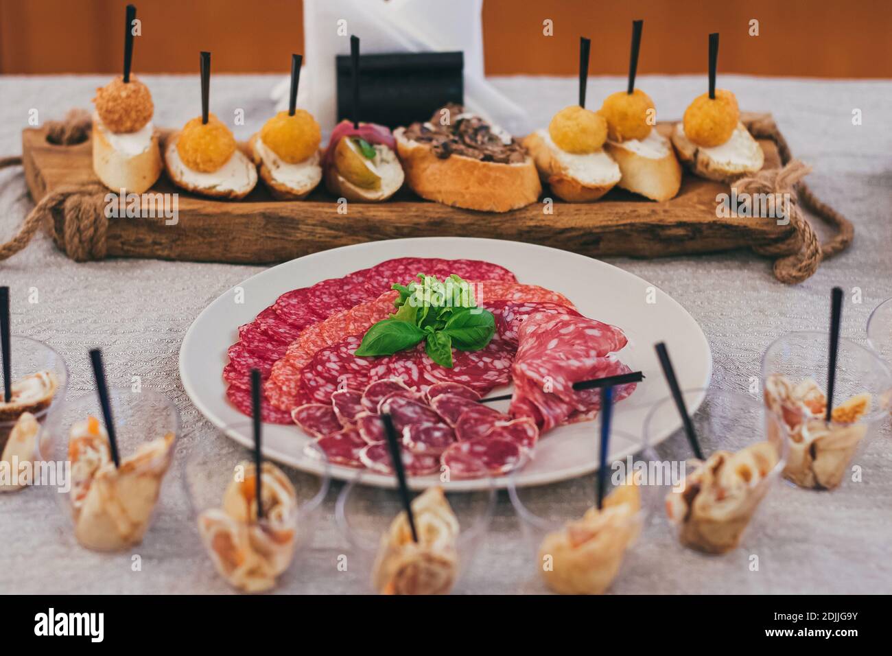 Catering table set service at restaurant before party Stock Photo - Alamy
