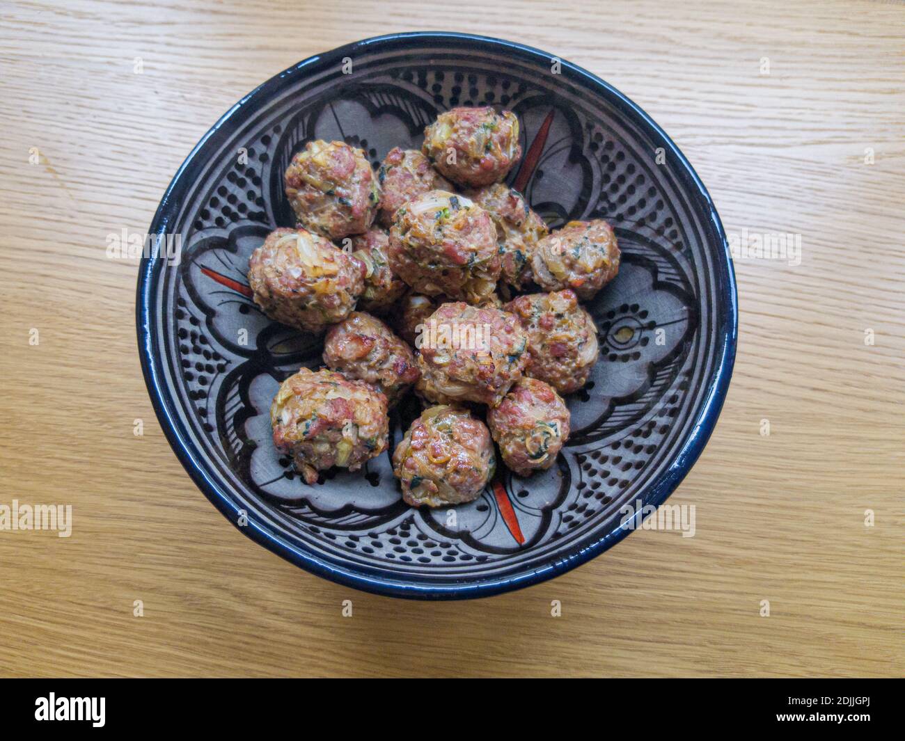 Moroccan kefta meat balls in a traditional bowl in Morocco on a wood ...