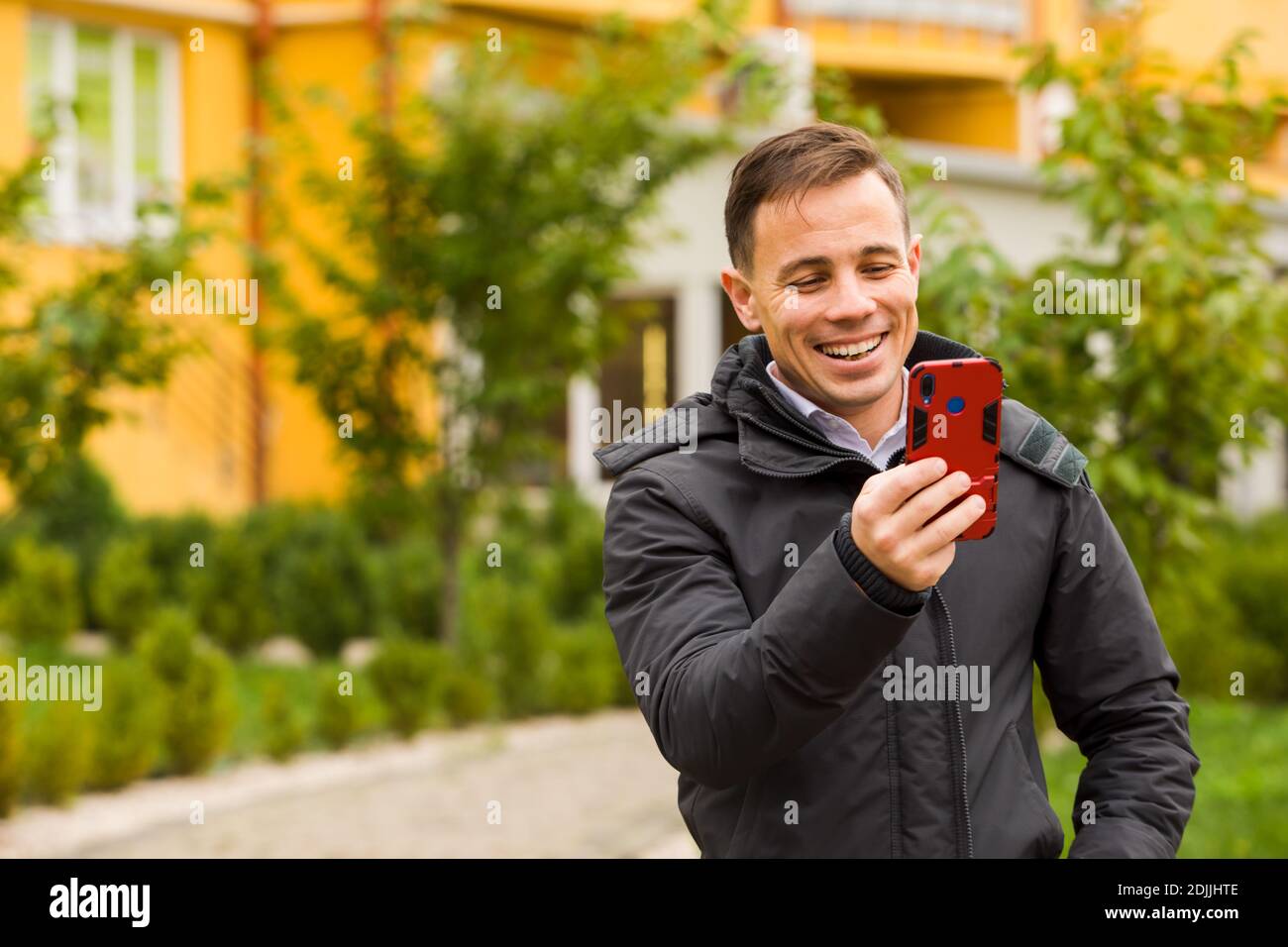 The man uses new technology to communicate while walking Stock Photo ...