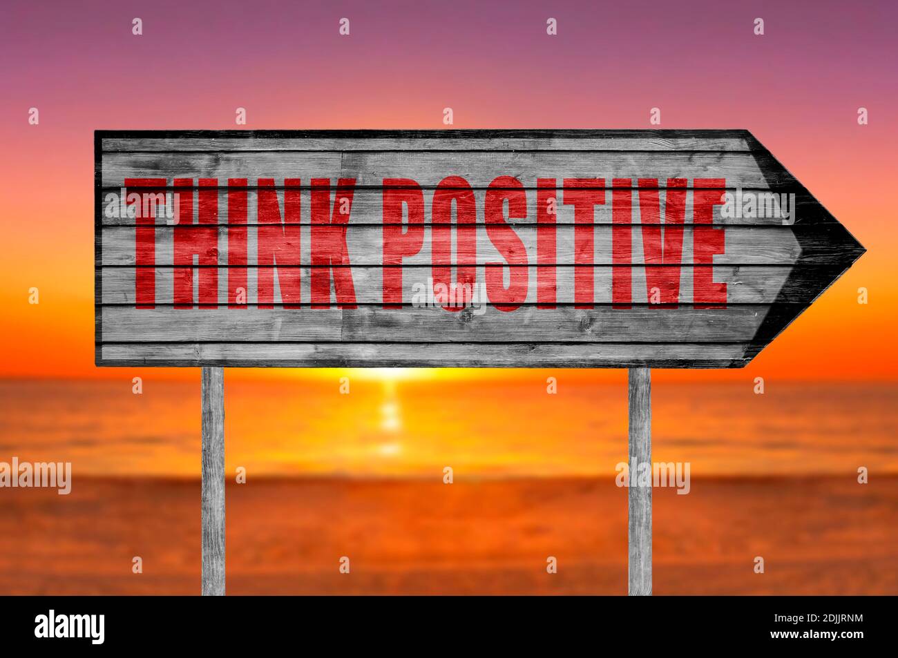 Red Think Positive wooden sign with on a beach background Stock Photo ...