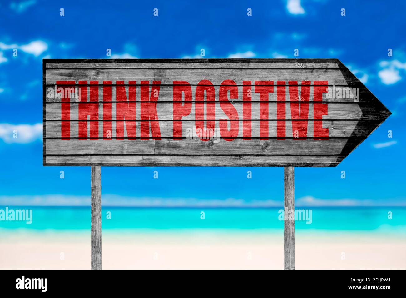 Red Think Positive wooden sign with on a beach background Stock Photo ...