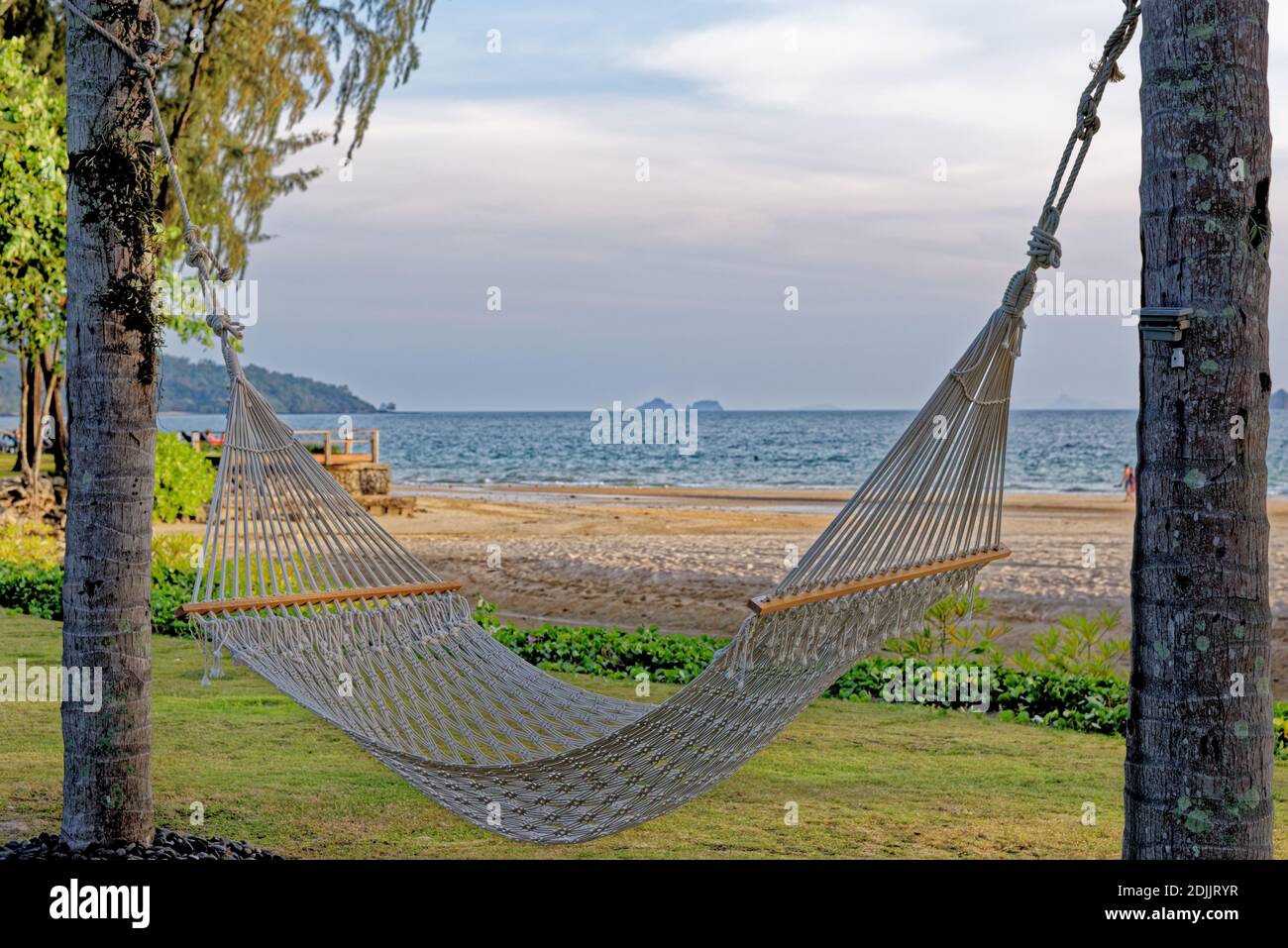A relaxing rope hammock tied between two palm trees - Thailand - Travel ...