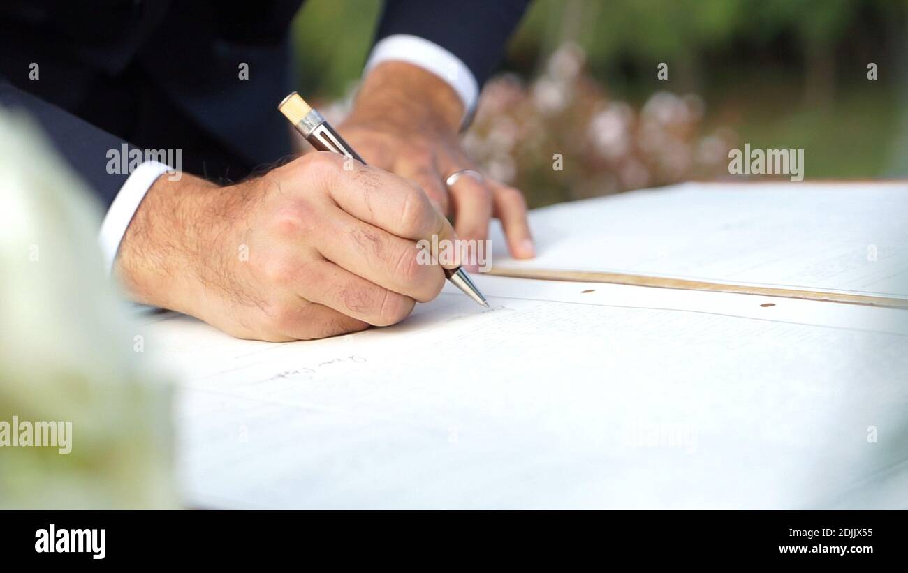 Signing wedding book hi-res stock photography and images - Alamy