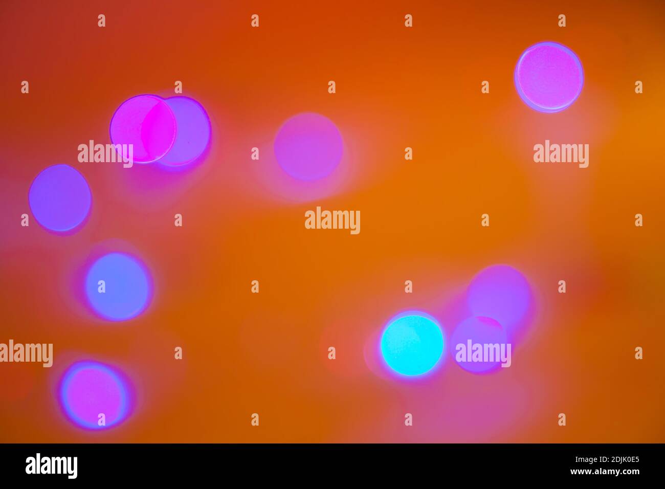 multi-colored lights on a dark background to blur Stock Photo - Alamy