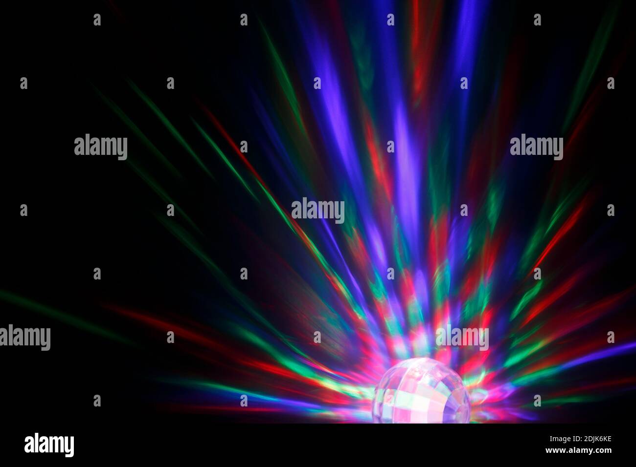 Colorful red, green and blue rays of light or light beams and angular ...