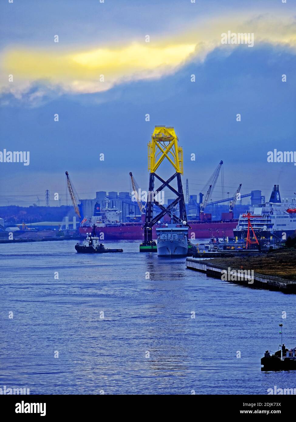 Wind turbine tops on barge Stralsund with tug En Evant 20 waiting at ...