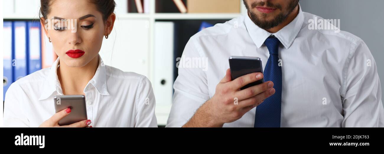 Business colleagues using modern smartphones at work Stock Photo - Alamy