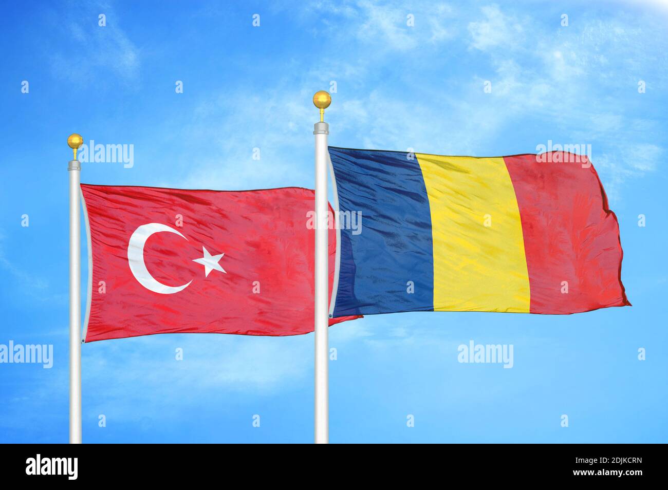 Turkey and Chad two flags on flagpoles and blue cloudy sky Stock Photo ...