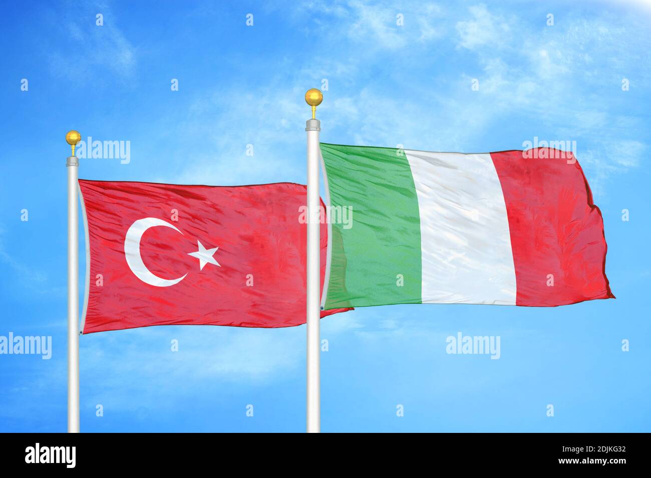 Turkey and Italy two flags on flagpoles and blue cloudy sky Stock Photo ...