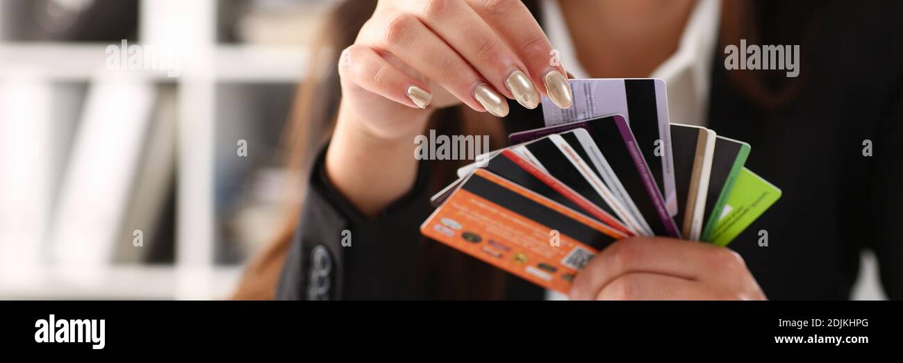 Young woman hands holding various bank cards Stock Photo - Alamy