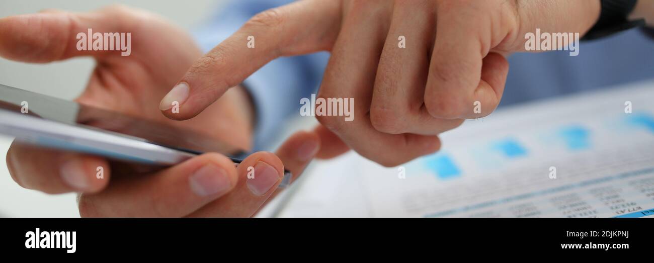 Businessman using modern mobile phone at work Stock Photo - Alamy
