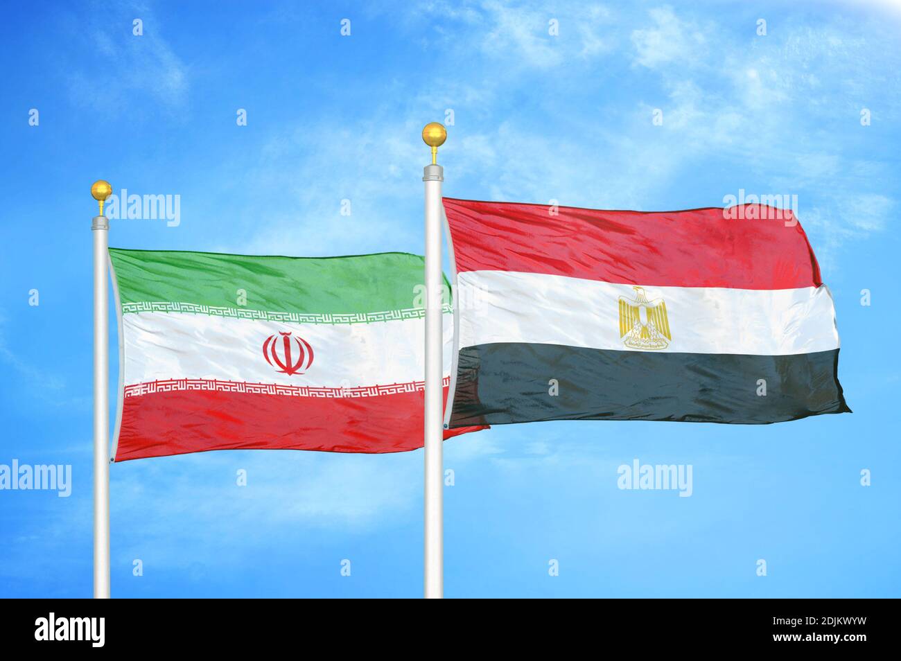 Iran and Egypt two flags on flagpoles and blue cloudy sky Stock Photo ...
