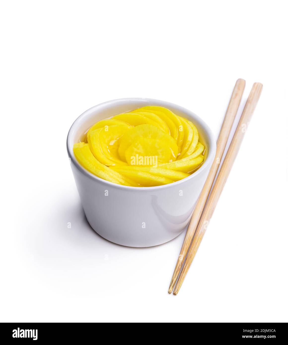 Marinated daikon slice with chopsticks isolated on white Stock Photo ...
