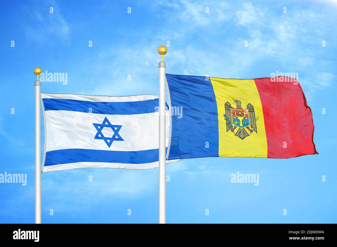 Israel and Moldova two flags on flagpoles and blue cloudy sky Stock ...