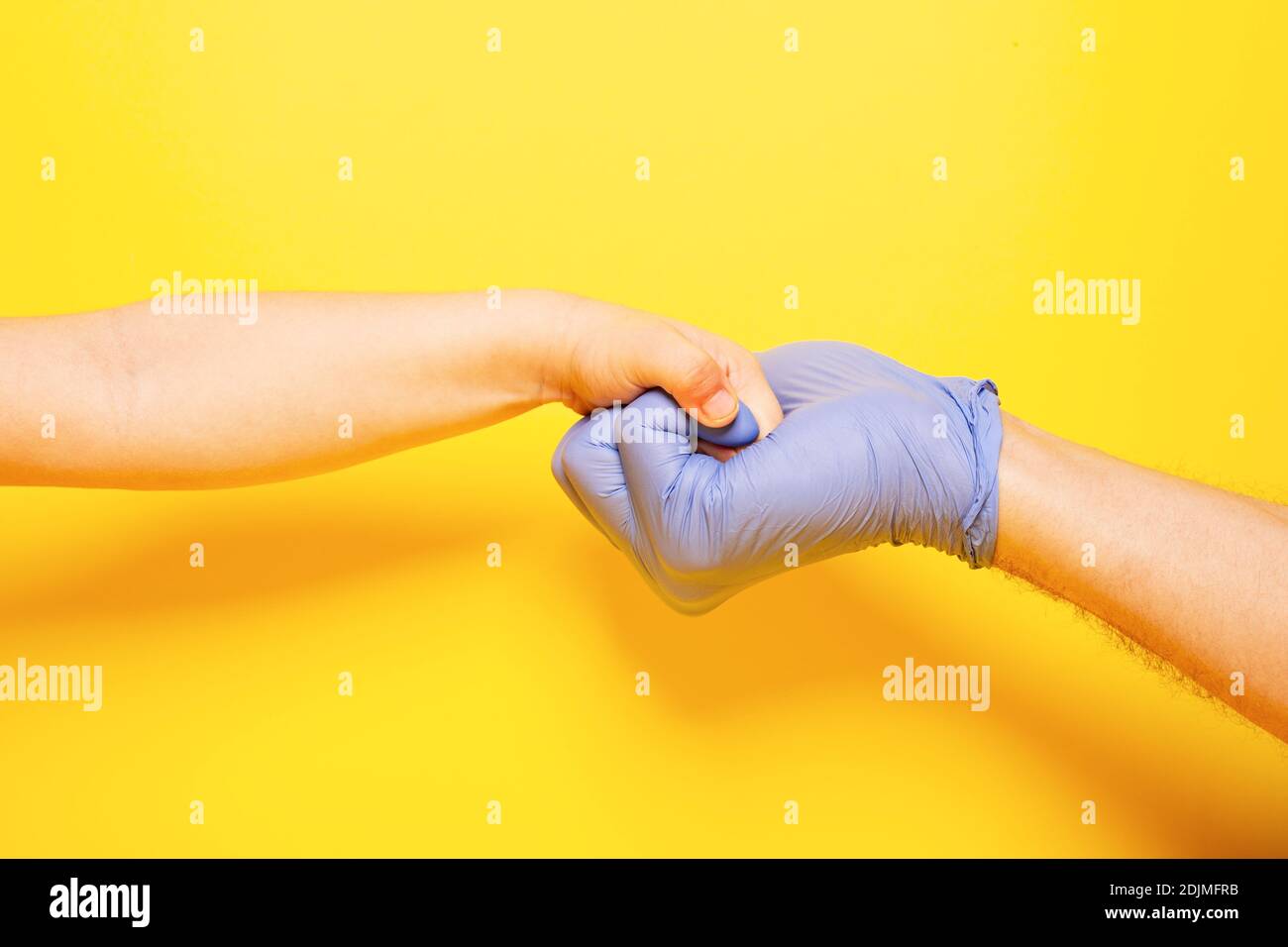 Hands gestures. shake of child and father hands, in latex glove ...