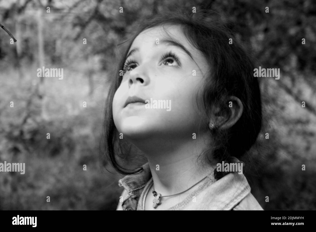Portrait Of Girl Looking Up Stock Photo - Alamy